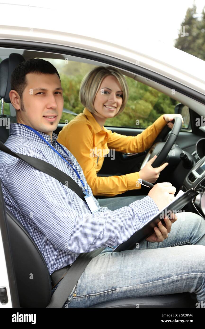 Learner driver student driving car with instructor Stock Photo - Alamy