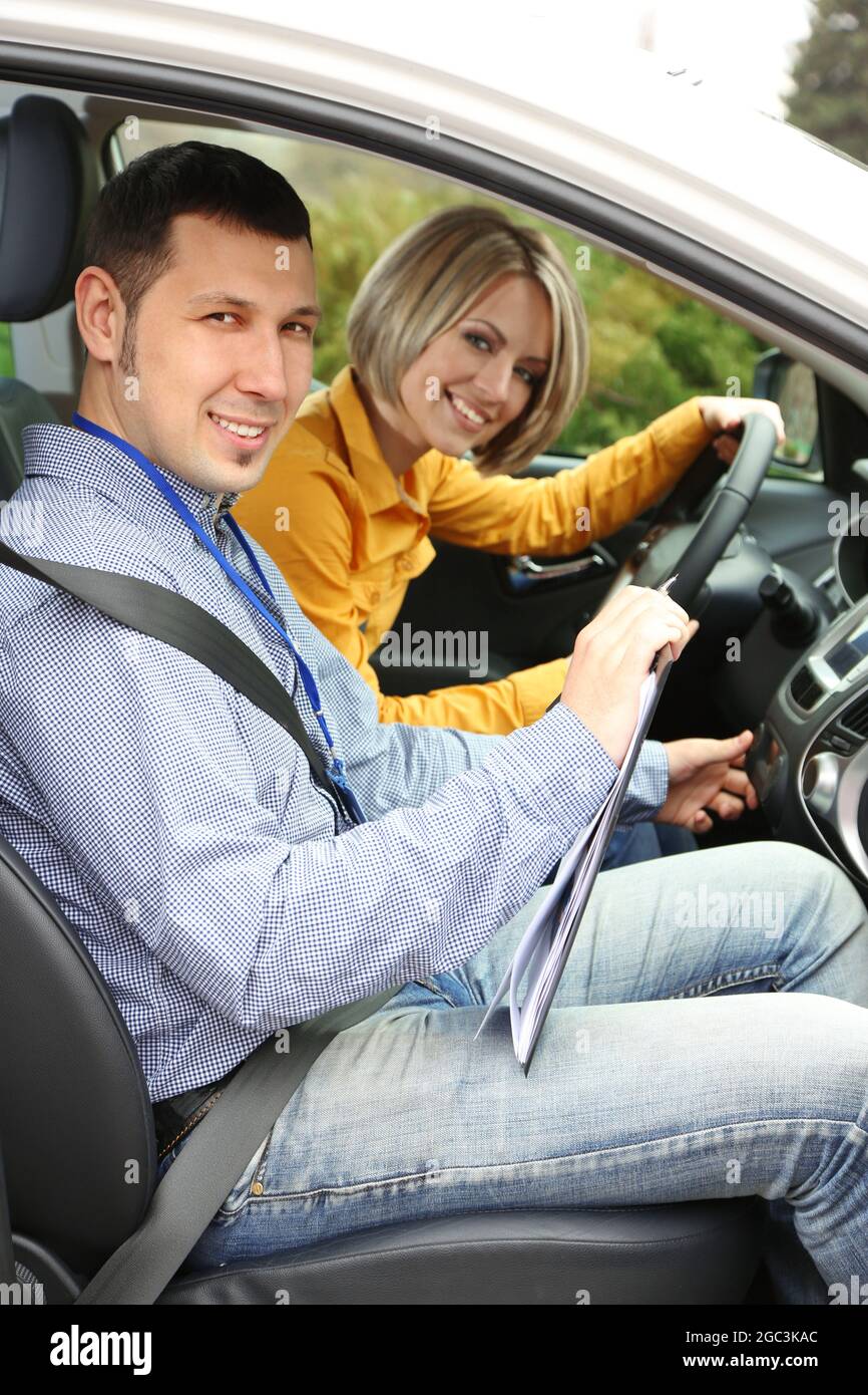 Learner driver student driving car with instructor Stock Photo - Alamy