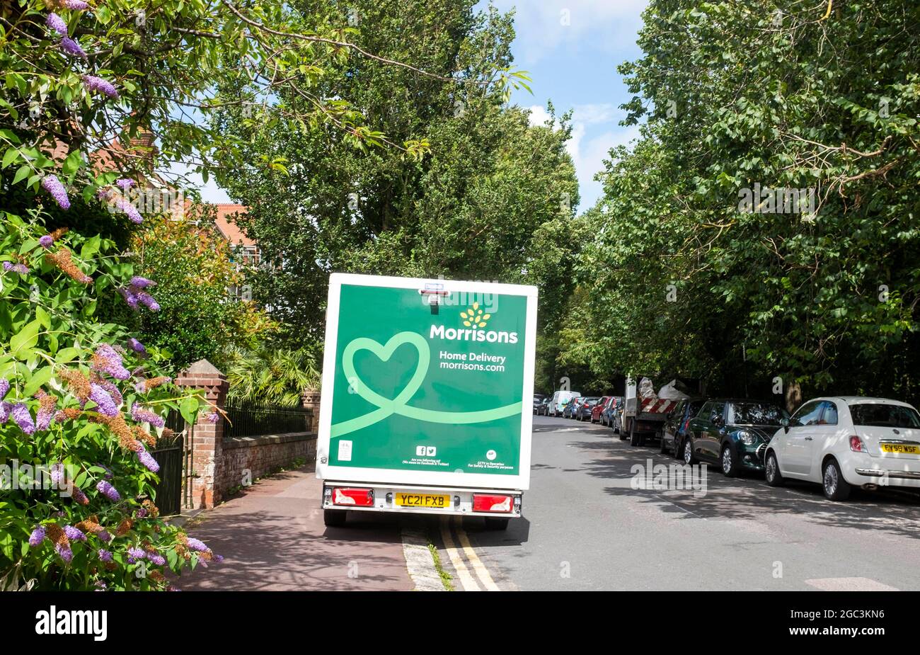 A Morrisons online home delivery van parked across a pavement over ...