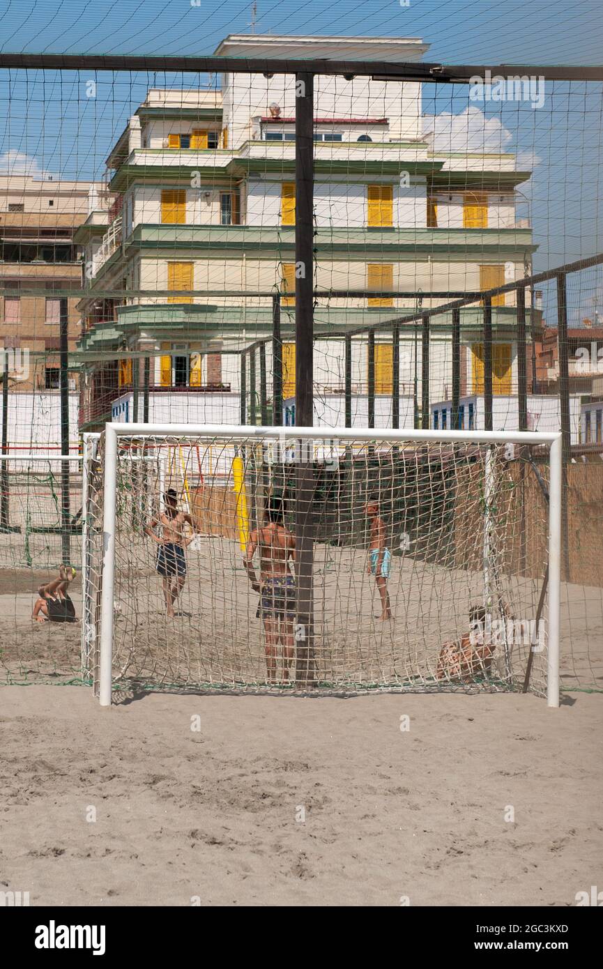 Ostia Rome, Italy 21/07/2021: boys play soccer, bathing resort ...
