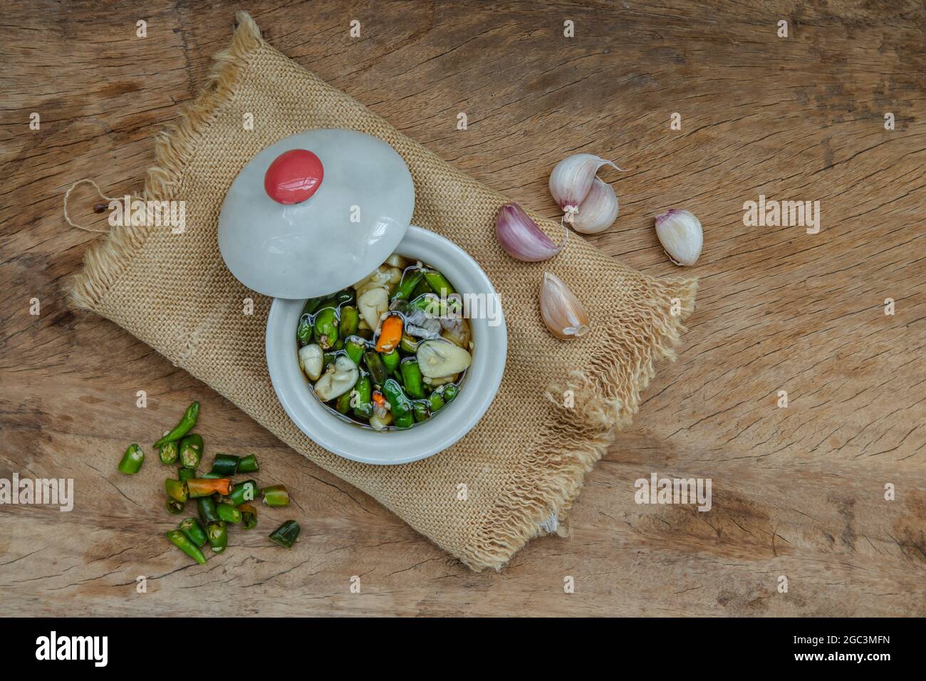 Thai chilli fish sauce and ingredients with thai green and red fresh ...