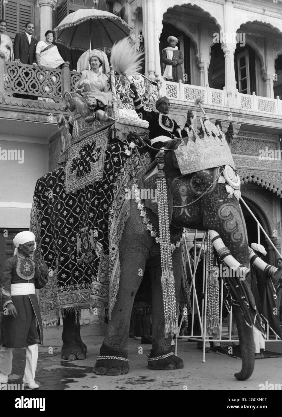 H. M. Queen Elizabeth II smiles from atop a ten-feet high elephant at ...