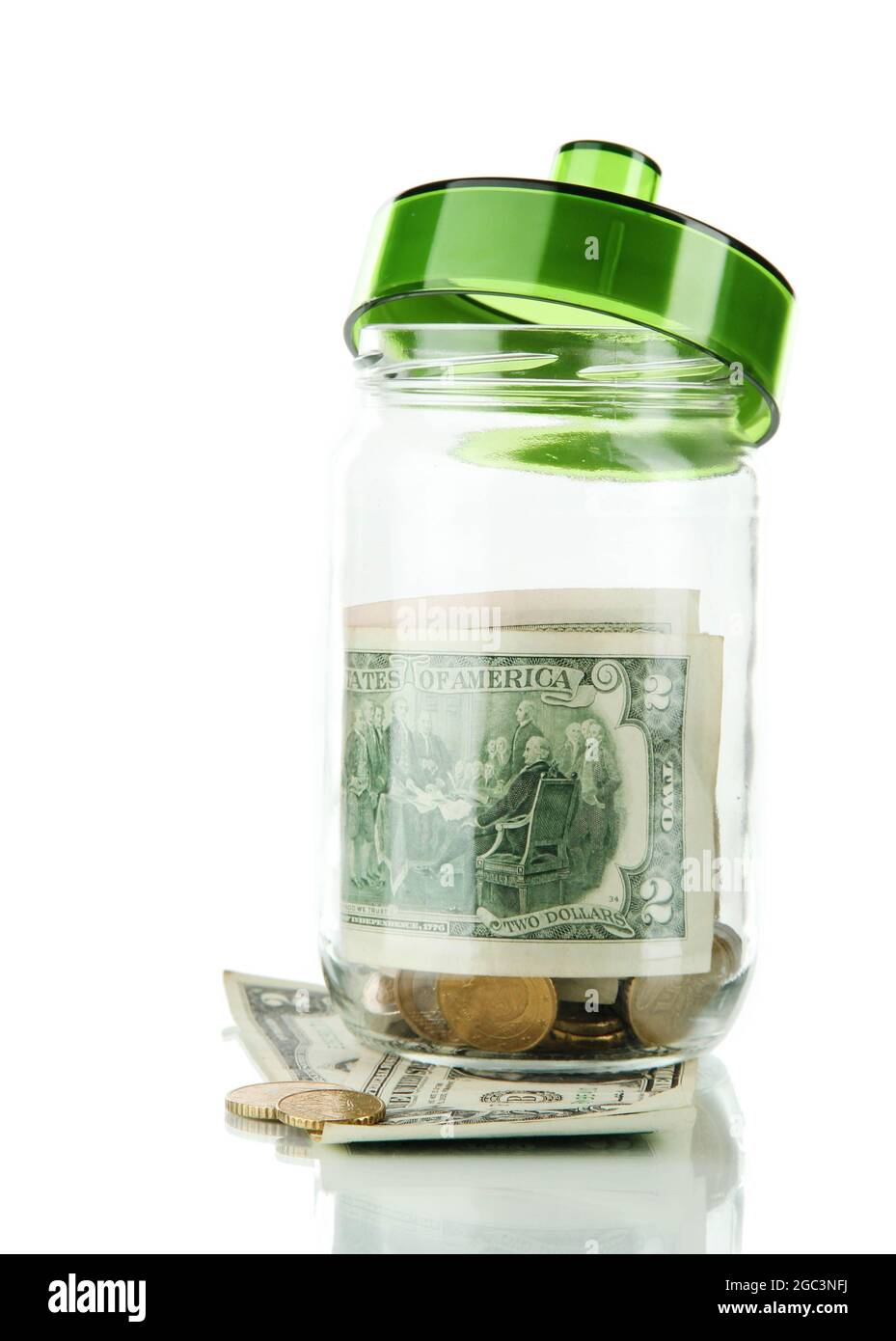 Glass jar with money isolated on white Stock Photo - Alamy