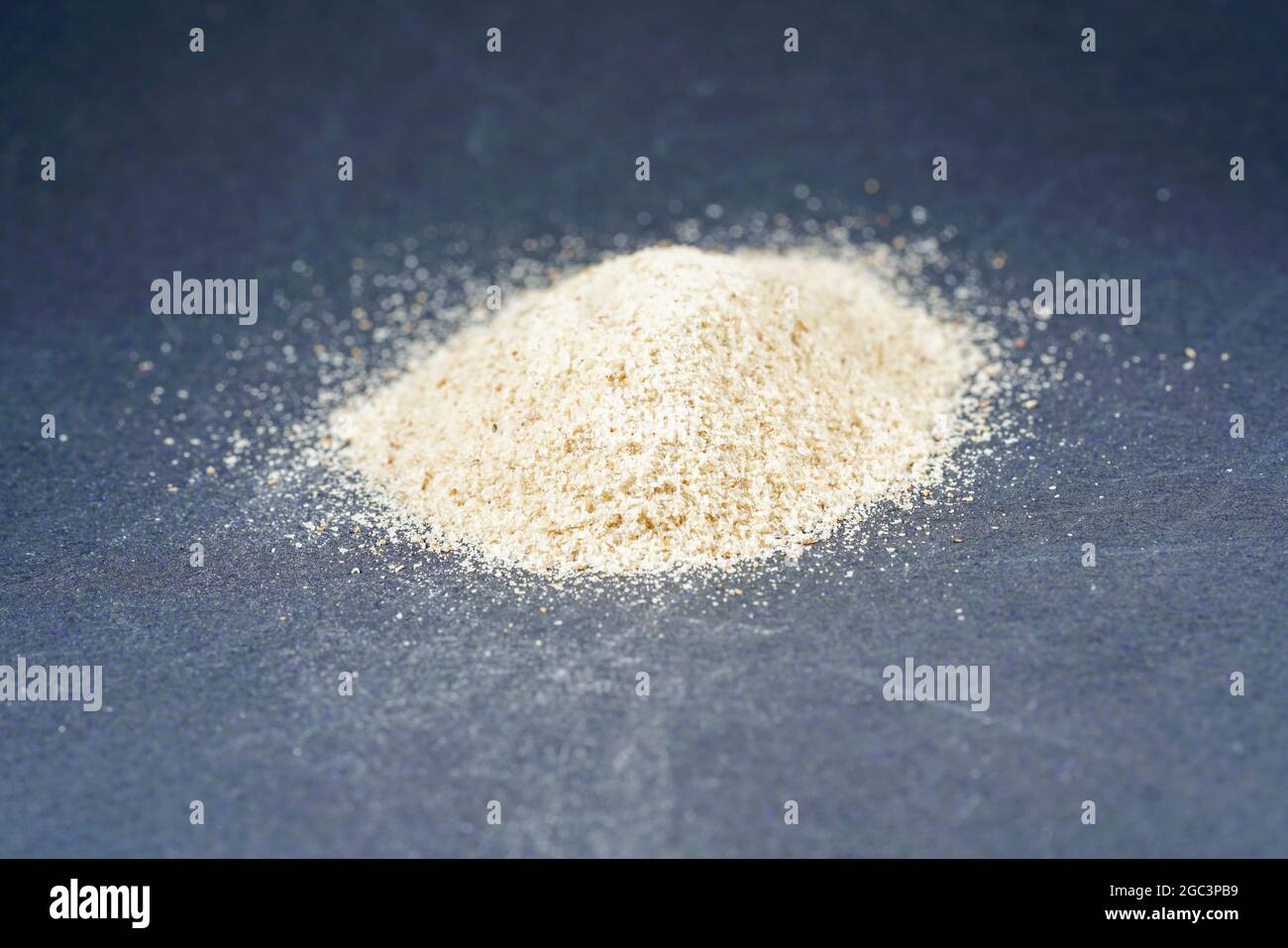 Indian flea seeds photographed in the studio against a black background ...