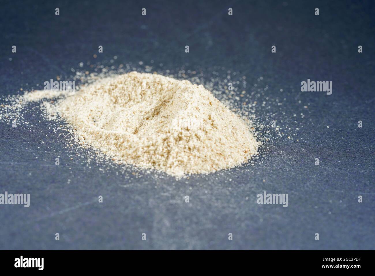 Indian flea seeds photographed in the studio against a black background ...
