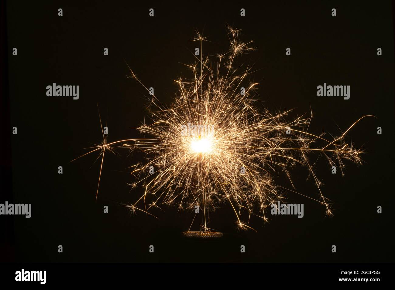New Year Christmas sparkler on dark background with bokeh lights Stock Photo - Alamy