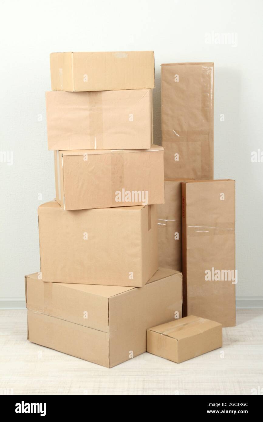 Different cardboard boxes in room Stock Photo - Alamy