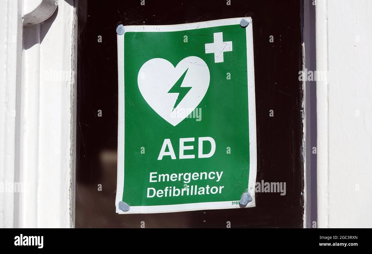 Closeup shot of a green Emergency Defibrillator sign Stock Photo - Alamy