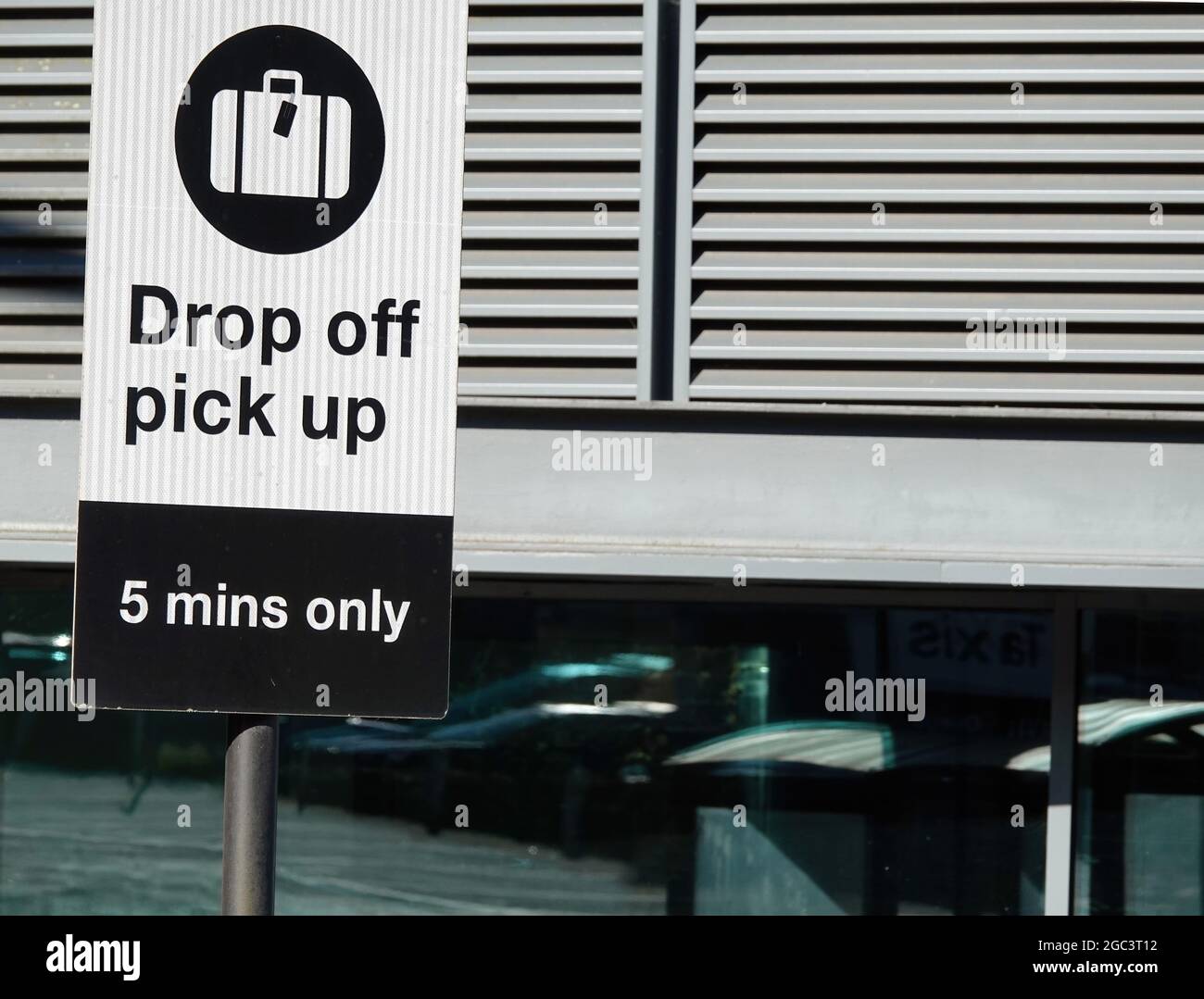 Closeup shot of drop off pick up sign by the road Stock Photo - Alamy