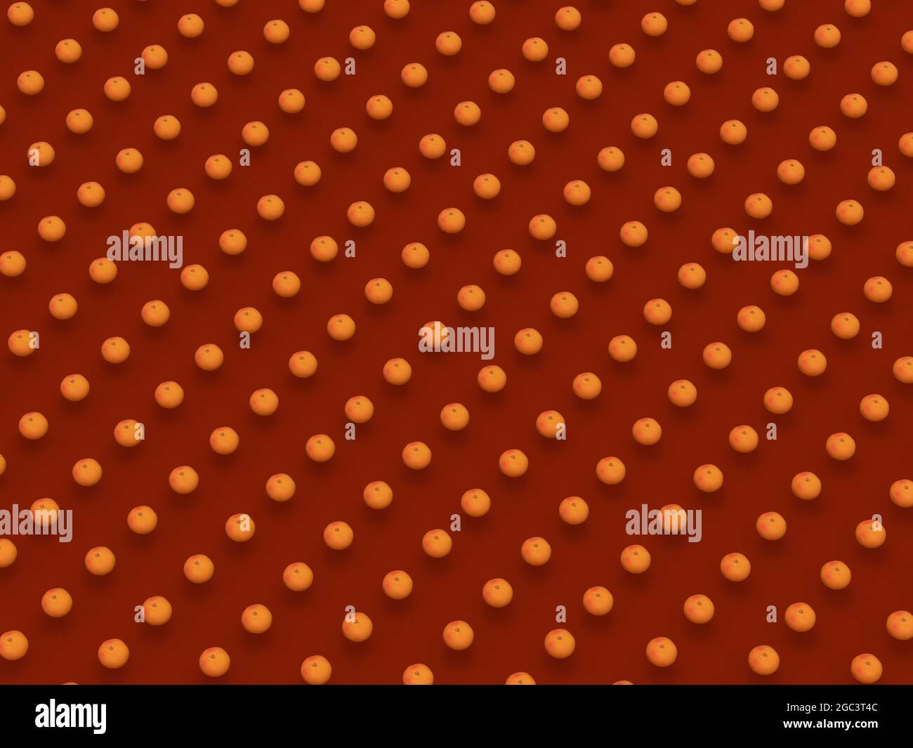 Rows of oranges or mandarins on a red background - texture background ...