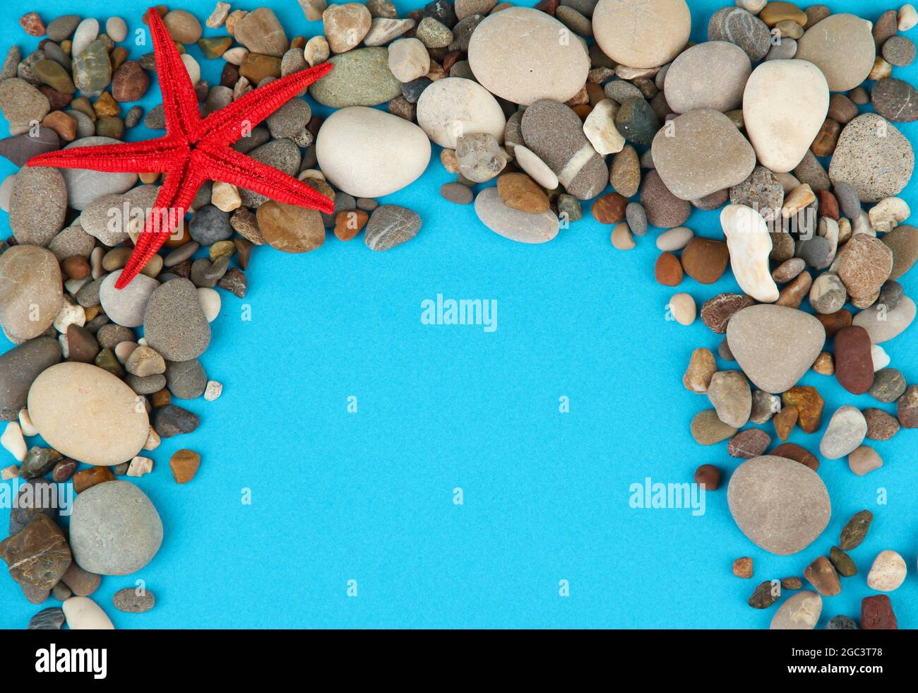 Frame of sea stones on color background Stock Photo - Alamy