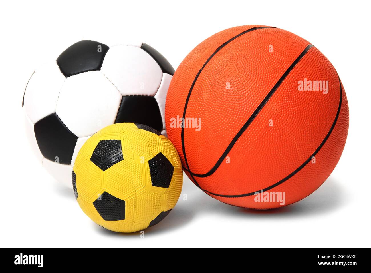 Basketball and football balls isolated on white Stock Photo - Alamy