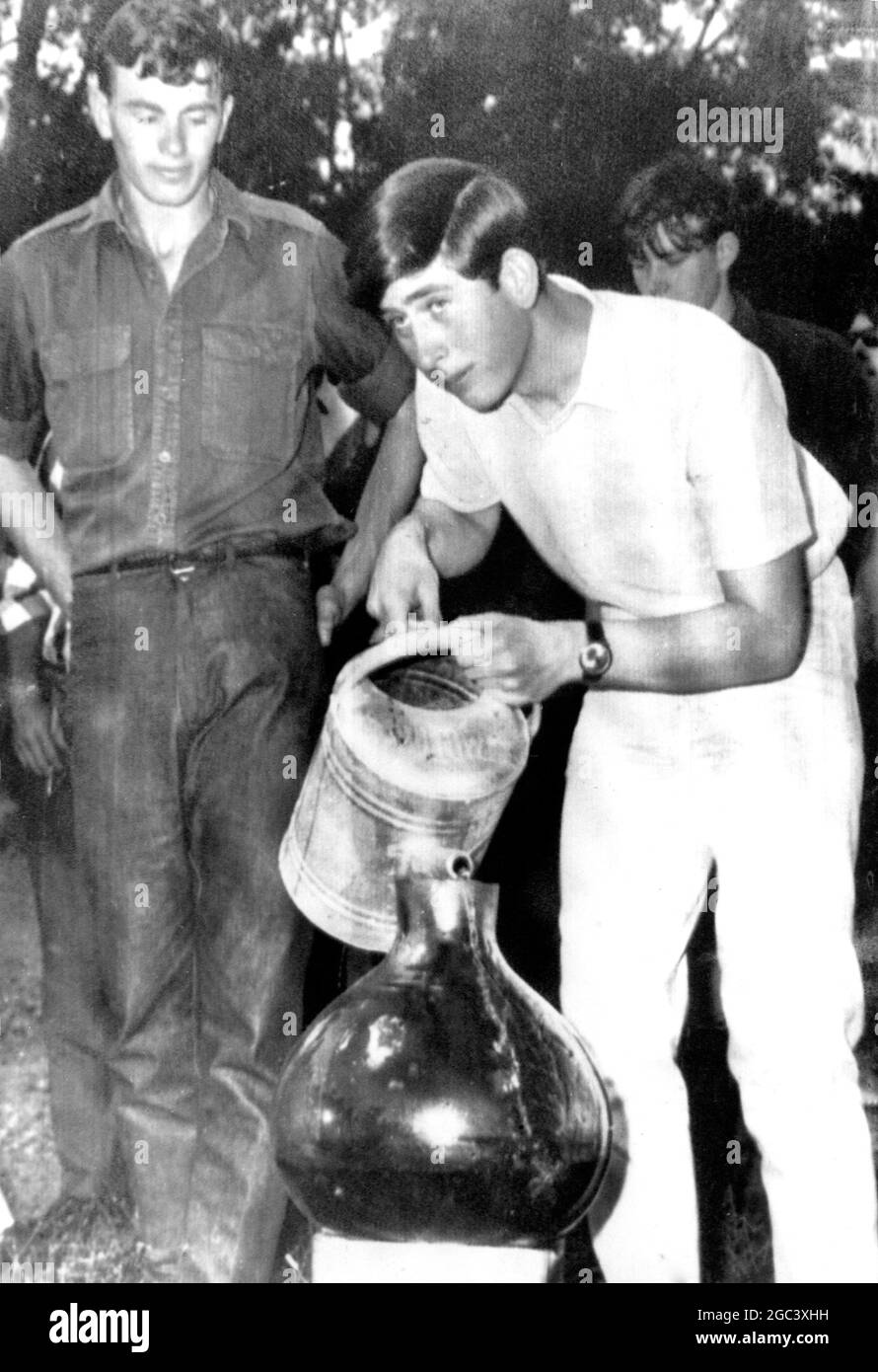 Prince Charles takes his turn to drown flies in fly catching bottle ...