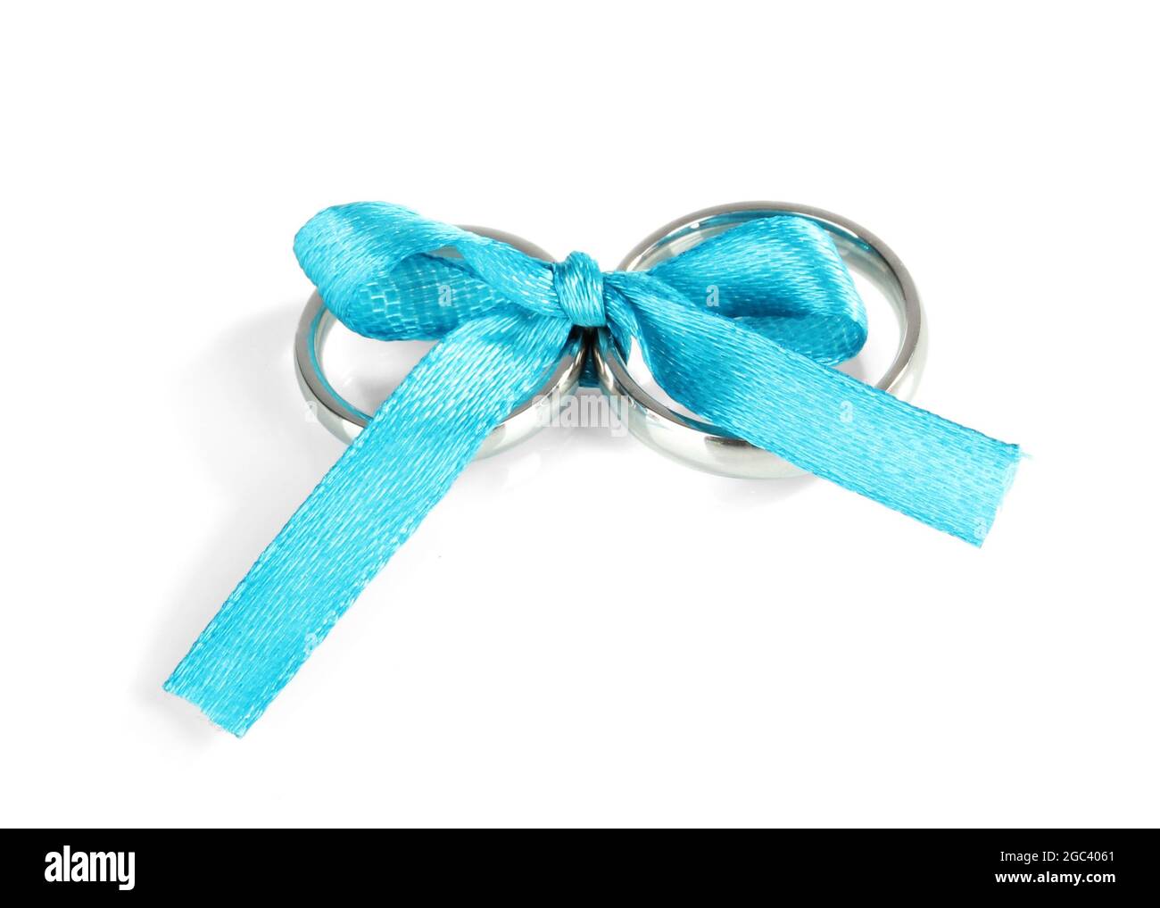 Wedding rings tied with ribbon isolated on white Stock Photo - Alamy