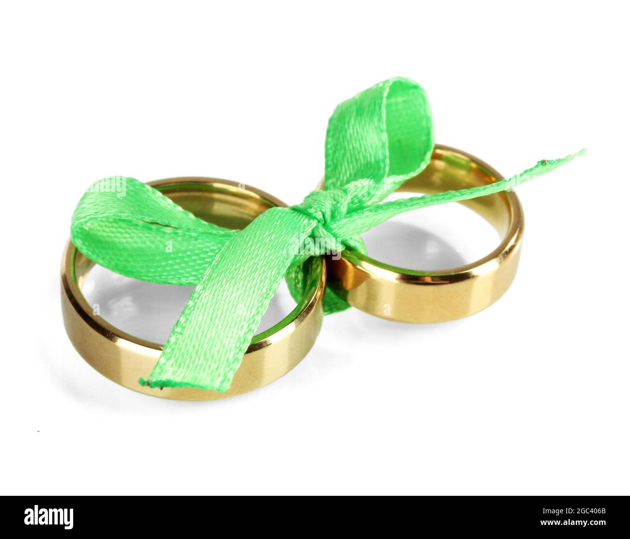 Wedding rings tied with ribbon isolated on white Stock Photo - Alamy