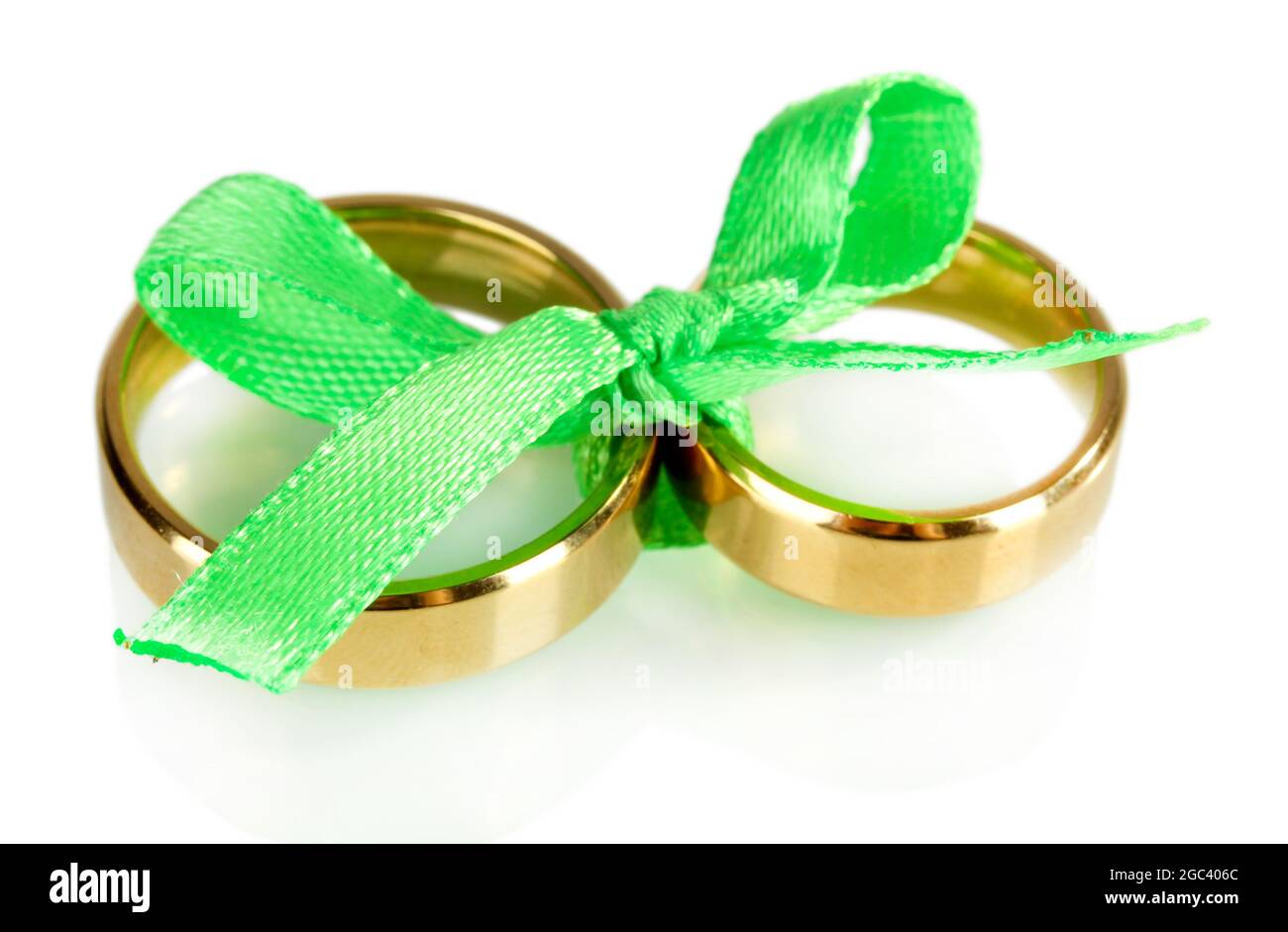 Wedding rings tied with ribbon isolated on white Stock Photo - Alamy