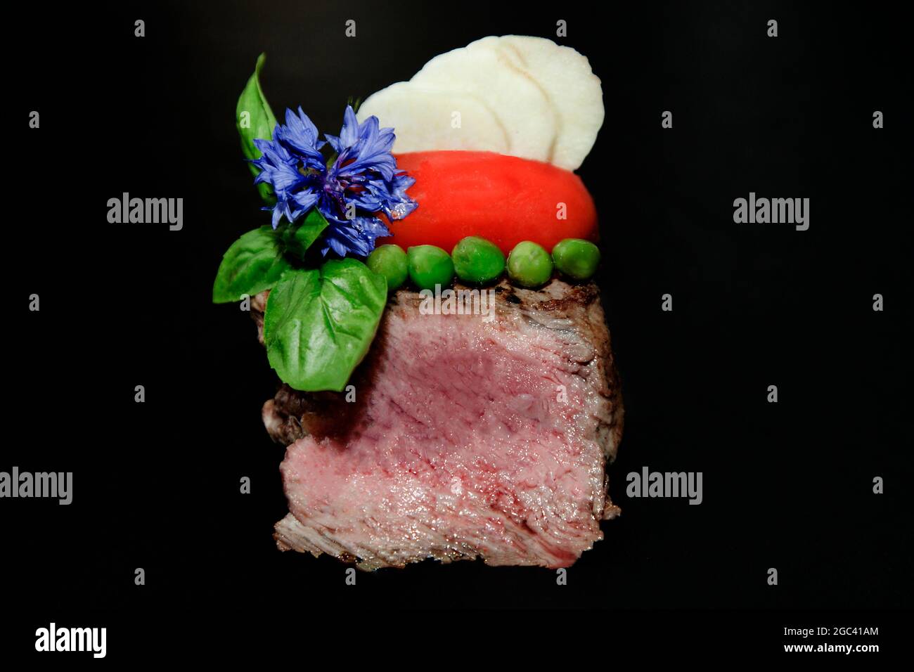 Steak, decorated with cornflower, basil etc Stock Photo - Alamy