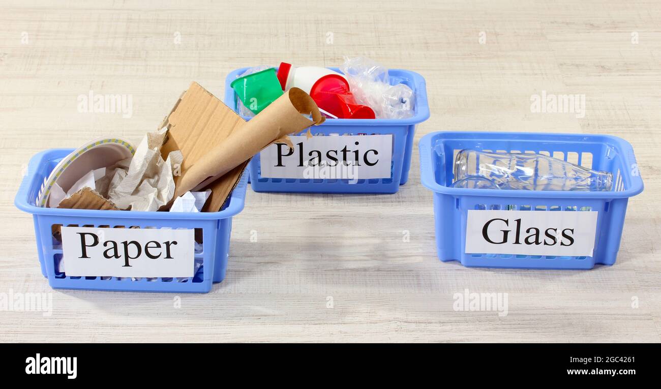 Three baskets of assorted debris on room background Stock Photo - Alamy