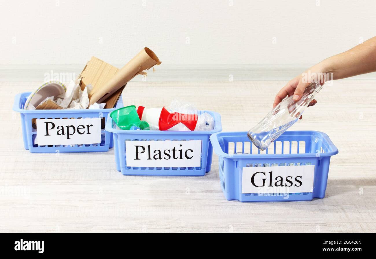 Three baskets of assorted debris on room background Stock Photo - Alamy