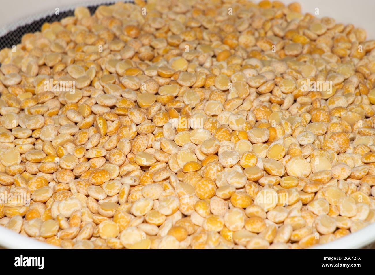 Closeup shot of yellow lentils in a sieve Stock Photo - Alamy