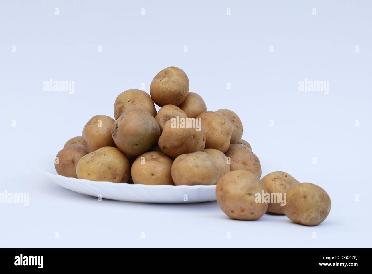 Baby potatoes small round potato from india on white background Asian ...