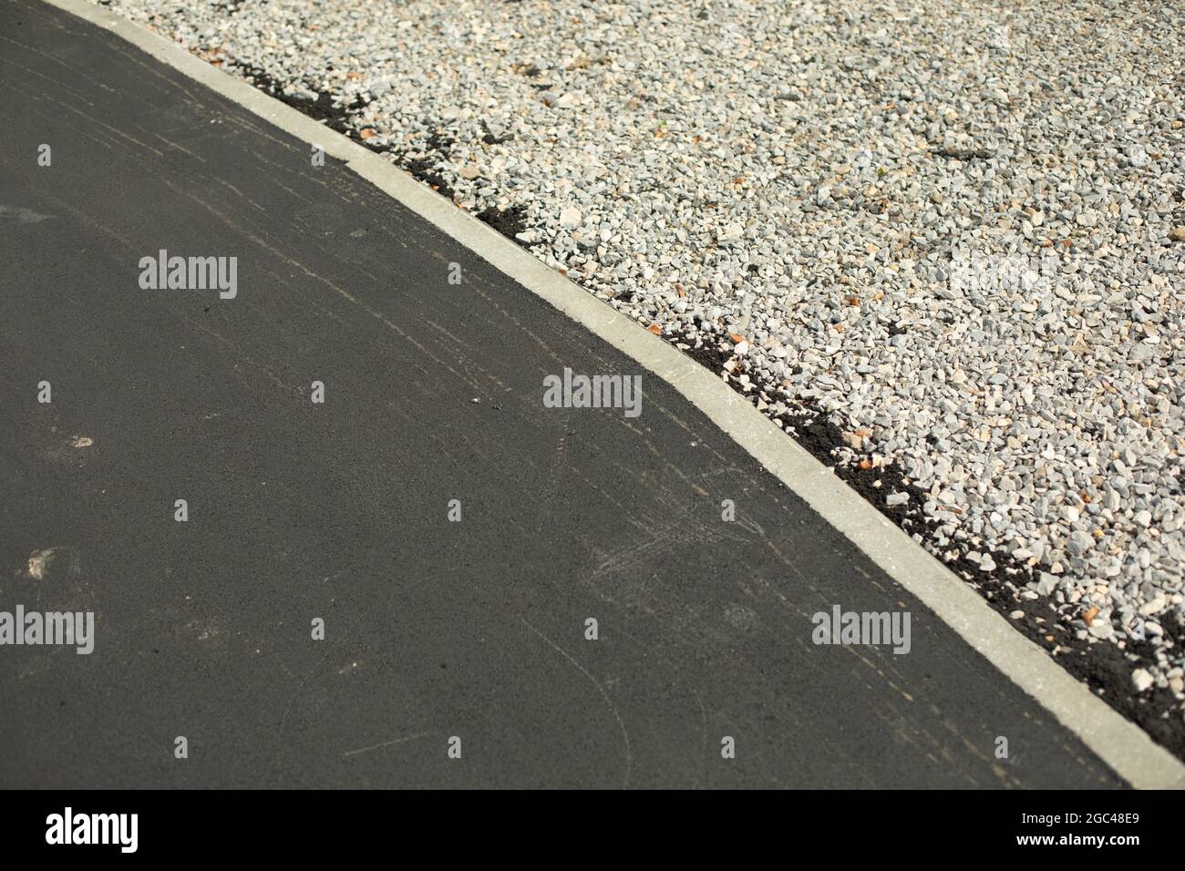 New asphalt road in the park. Narrow park path for cyclists. Repaired ...