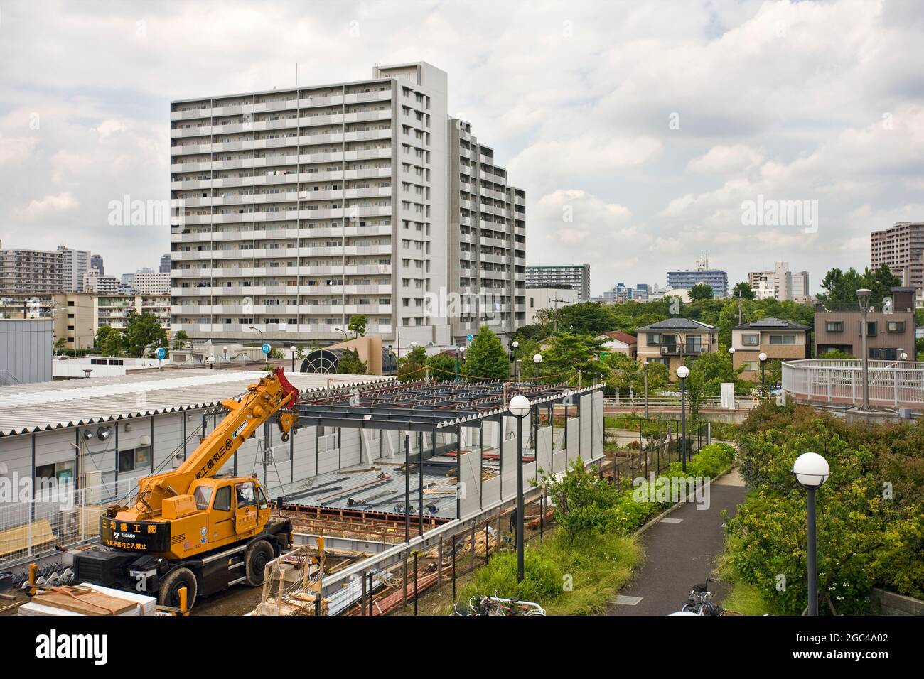 Building construction and apartment complexes near train station east ...