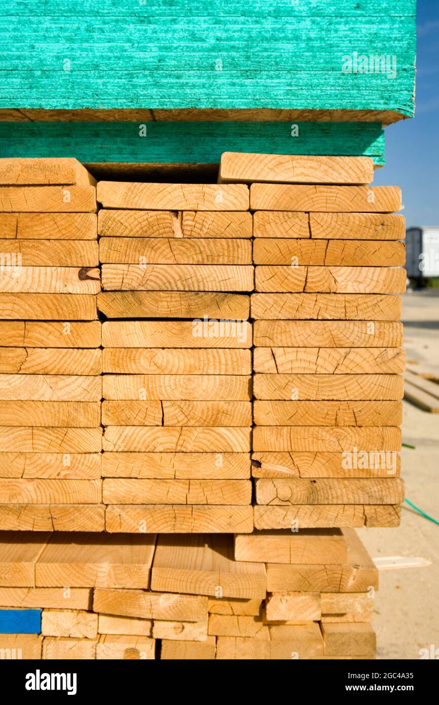 Lumber and plywood at a construction site Stock Photo - Alamy
