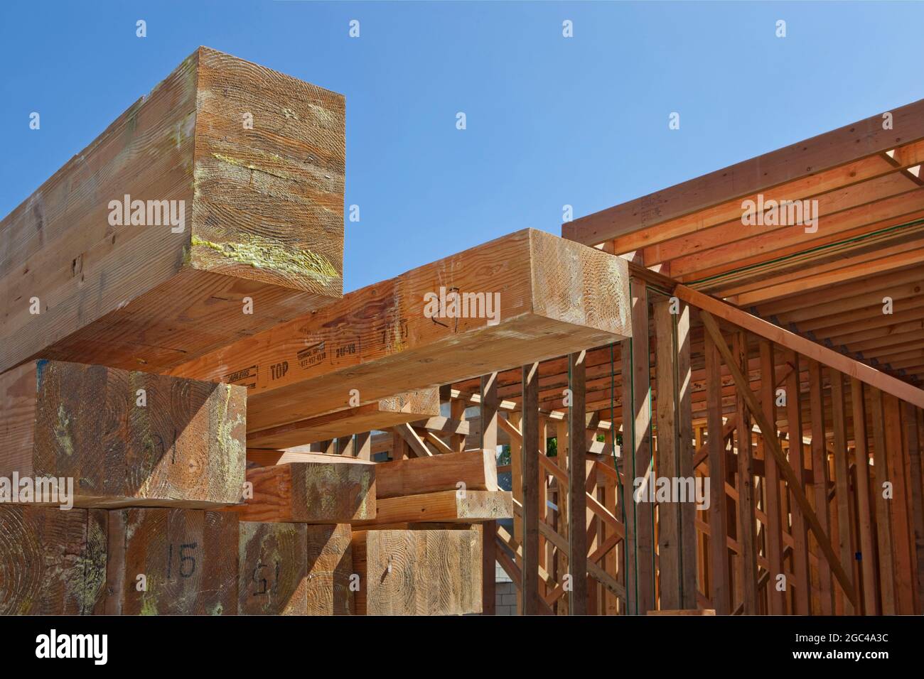 Lumber stacked condo construction site Stock Photo - Alamy