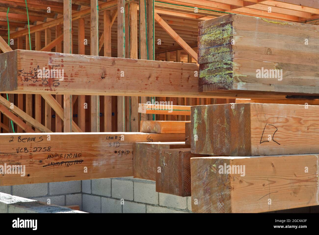 Lumber stacked condo construction site Stock Photo - Alamy