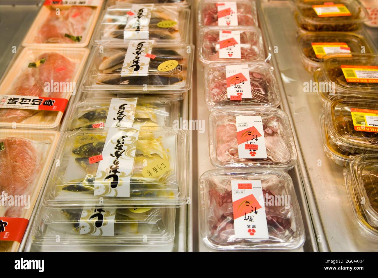 Neatly packaged seafood displayed at a Japanese American market Stock ...