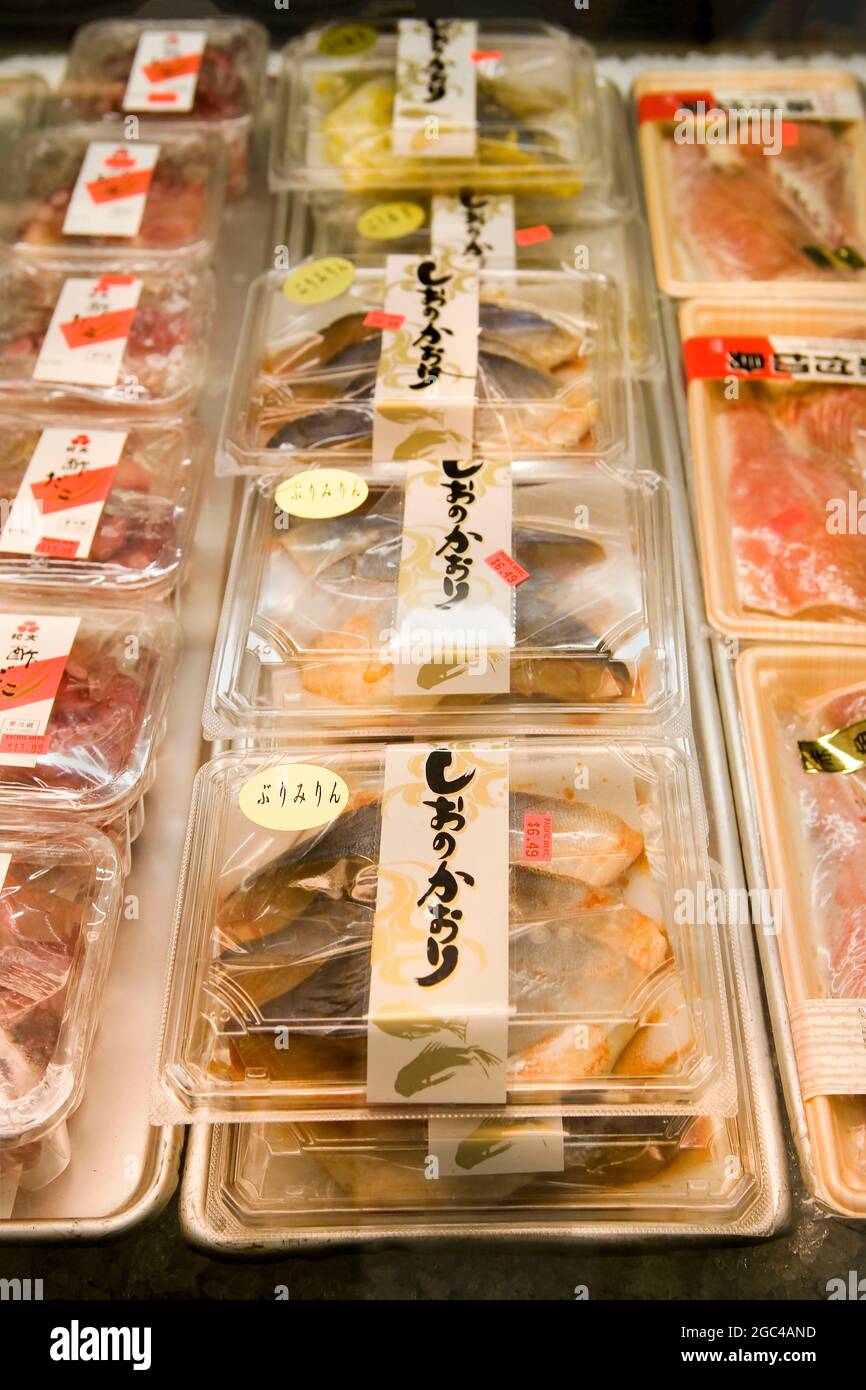 Neatly packaged seafood displayed at a Japanese American market Stock ...