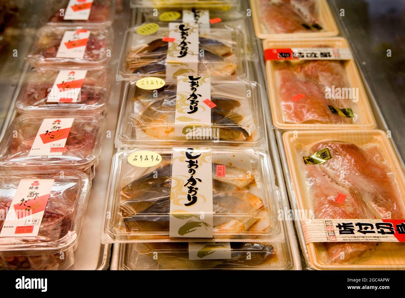 Neatly packaged seafood displayed at a Japanese American market Stock ...