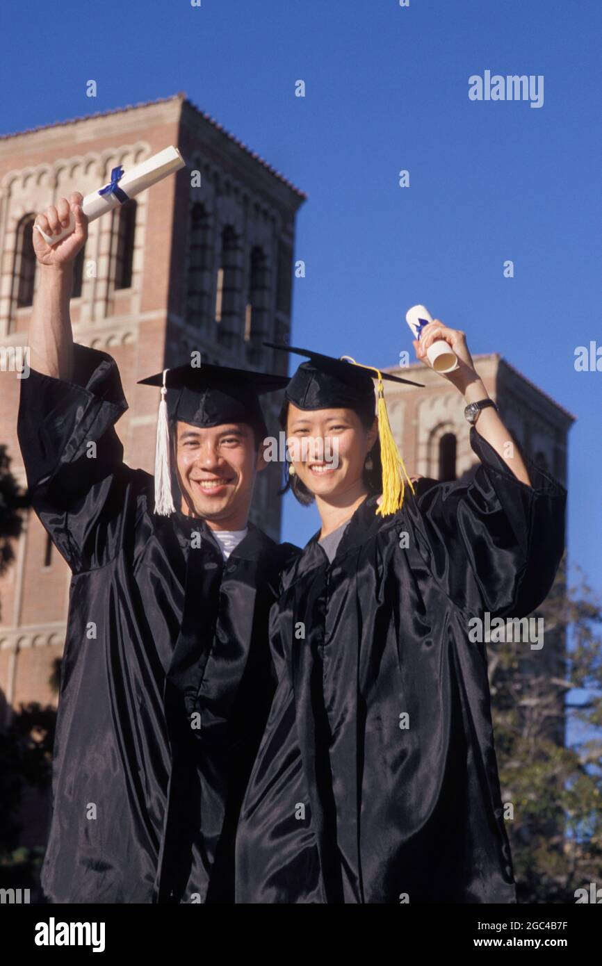 Happy graduating students diplomas hi-res stock photography and images - Alamy