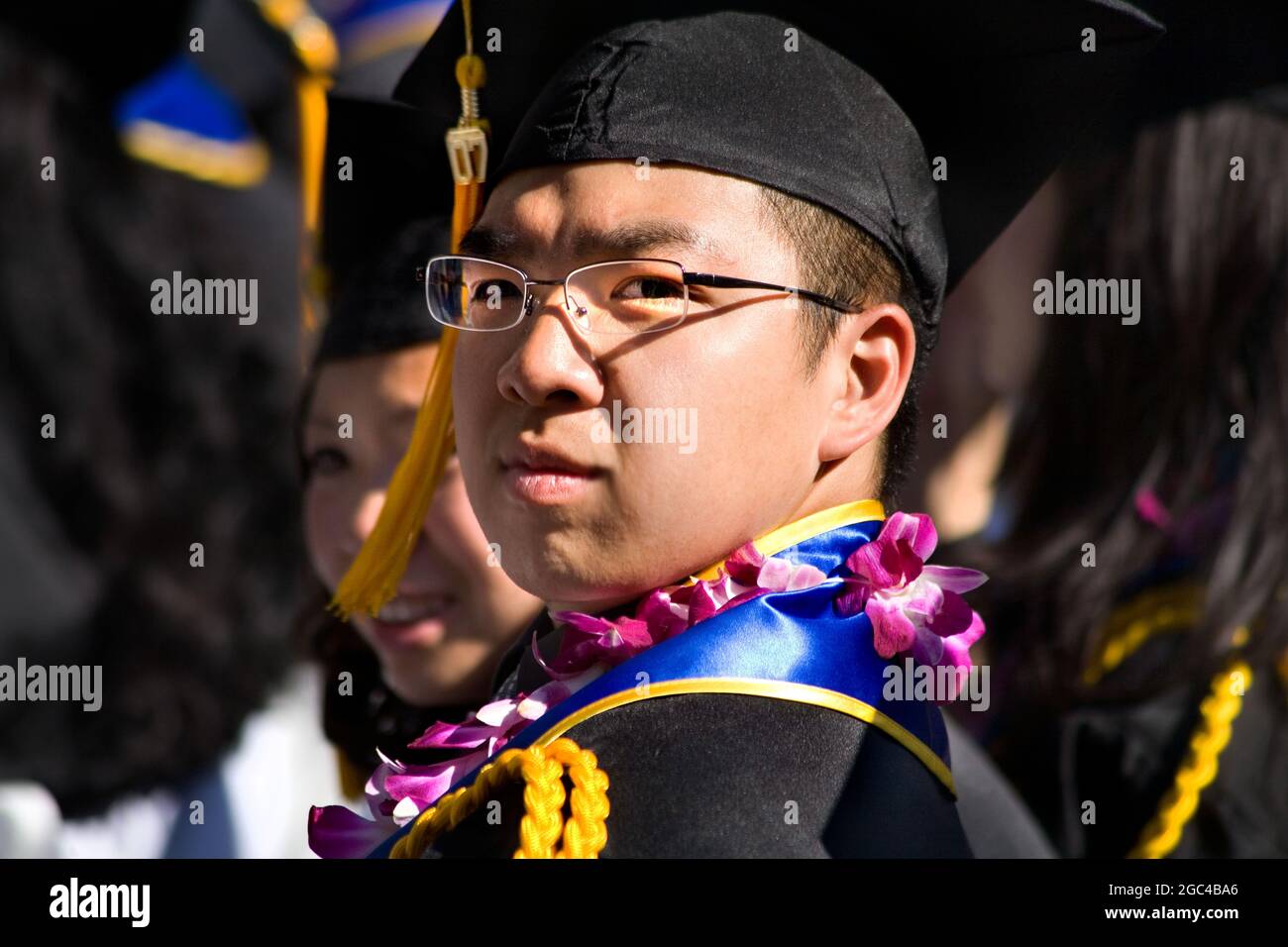 A young Asian "honors" graduate H Stock Photo - Alamy