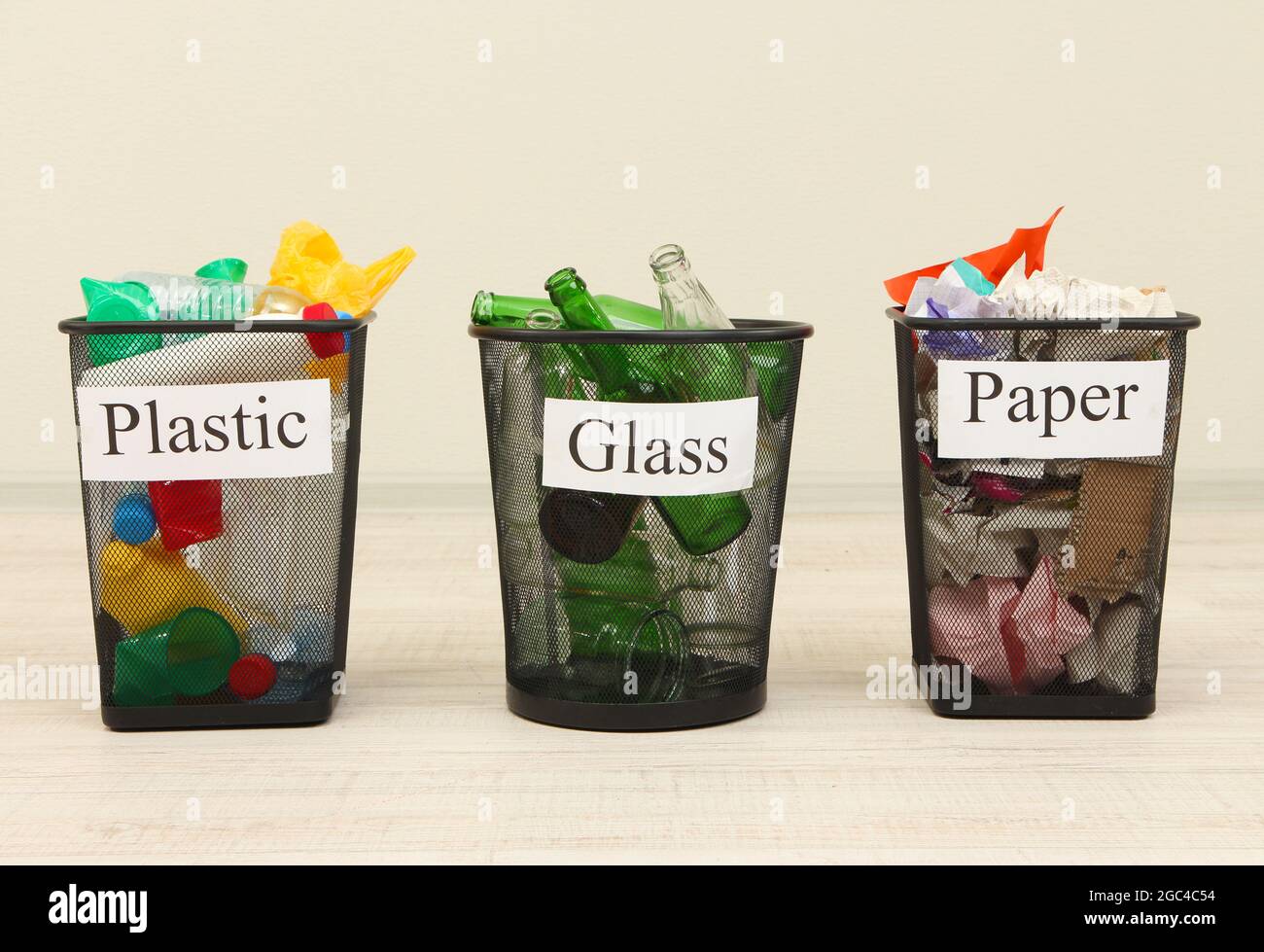 Buckets for waste sorting on room background Stock Photo - Alamy