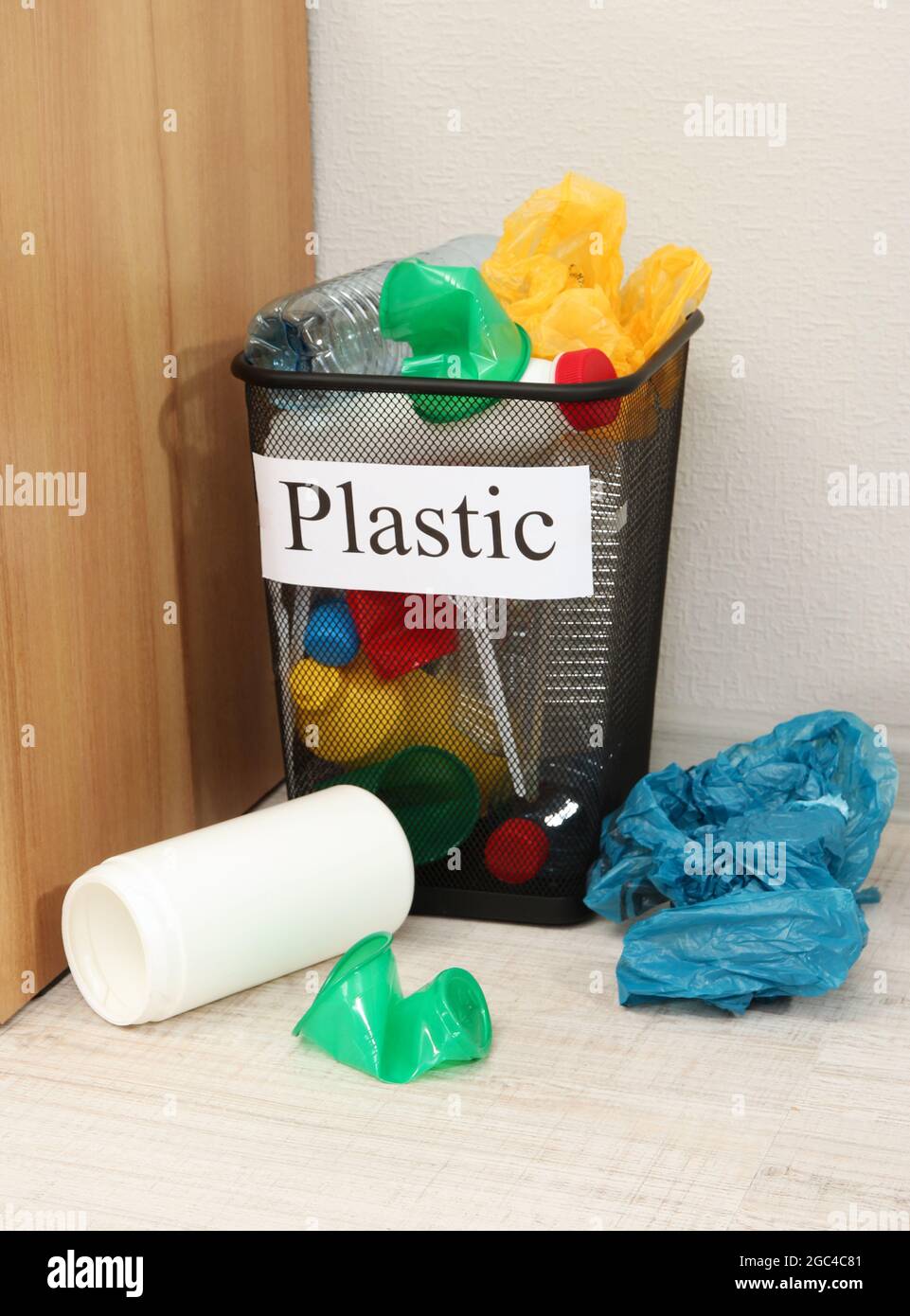 Bucket for waste sorting on room background Stock Photo - Alamy