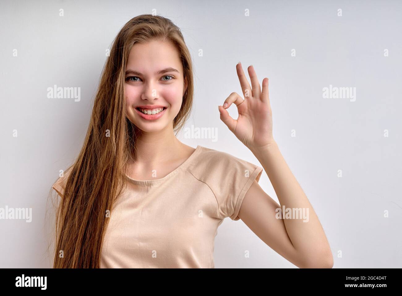 Everything will be OK. good-looking teenage girl with long hair showing ...
