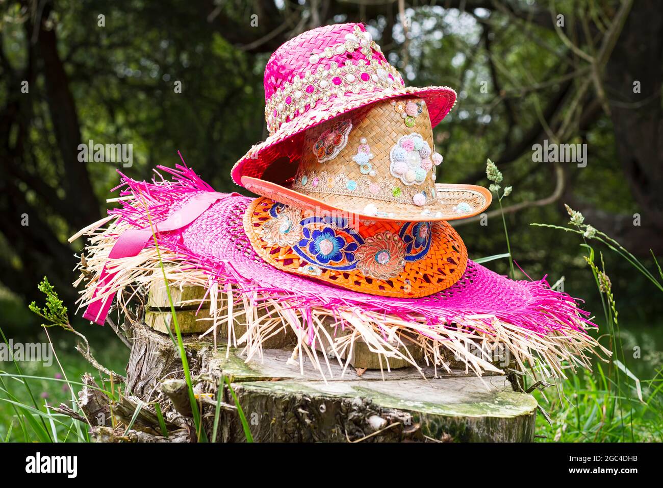 Exterior photograph of some beautiful hats in trend.The hats are orange ...