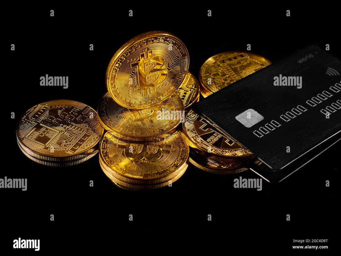 Golden coin with bitcoin logo and credit card. Leader in cryptocurrency ...