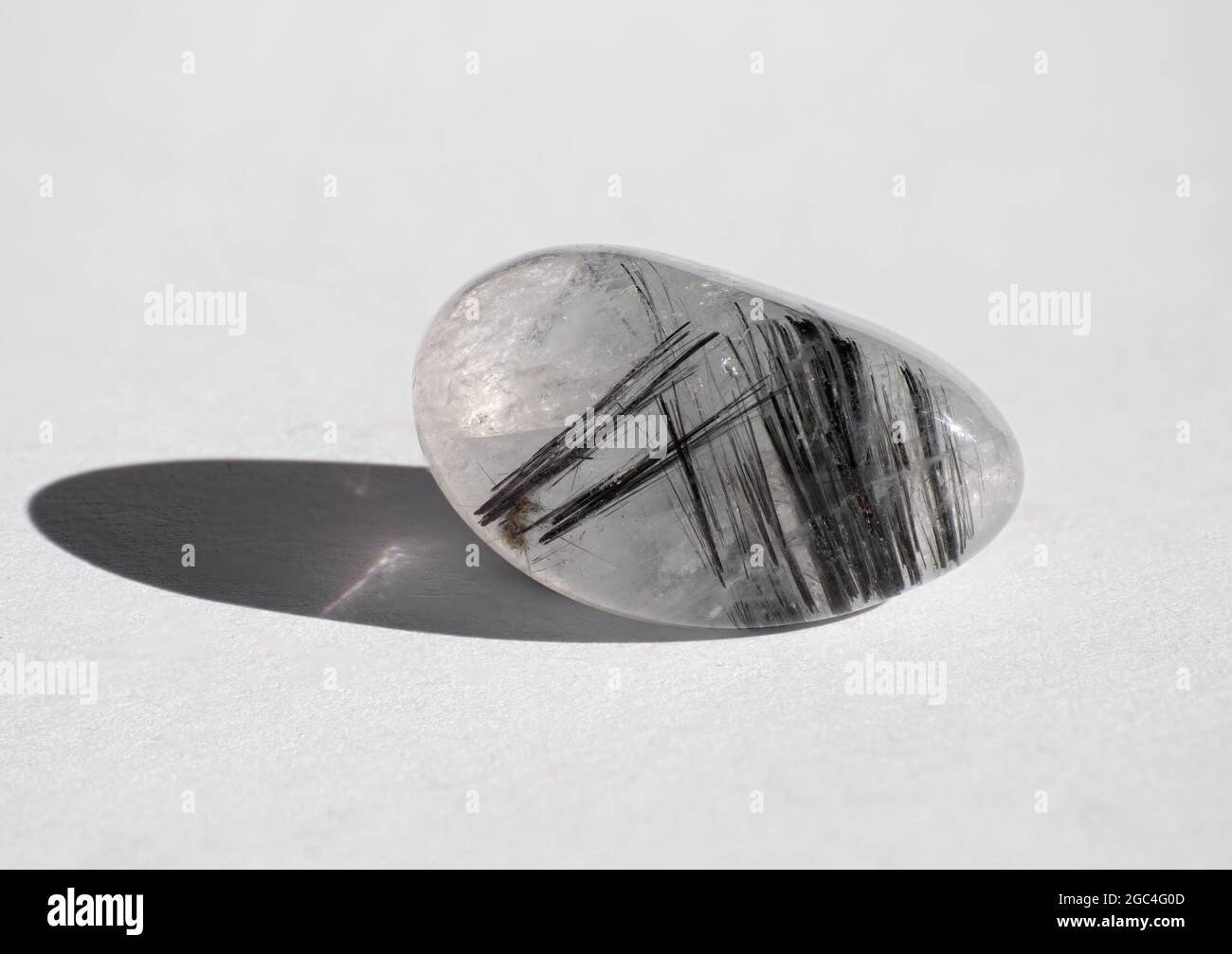 Tourmalinated Quartz tumble - natural stone Stock Photo - Alamy