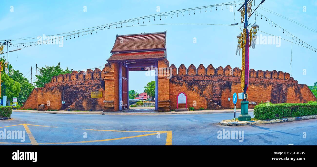 Panorama with ruins of brick rampart and Pratu Thanang Gate with ...