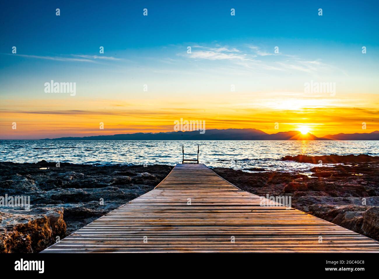 View Wooden jetty on the sea, Peloponnes Greece Stock Photo - Alamy