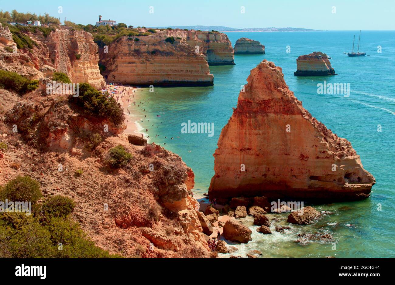 Famous Marinha Beach with its cliffs, rock formations and green crystal ...