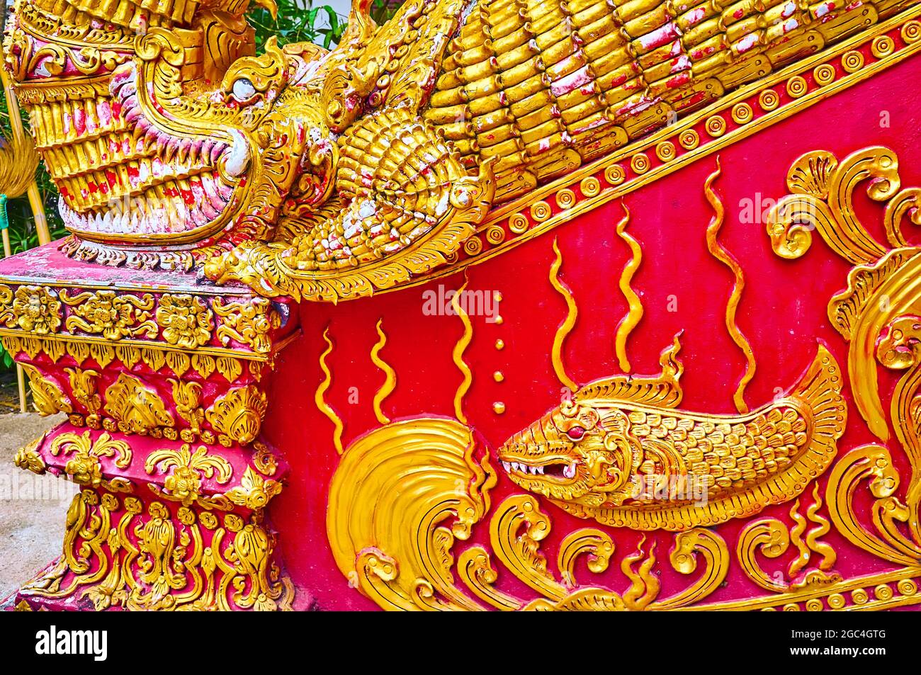 The rich decoration of bright red baluster of Wat Phrao temple with ...