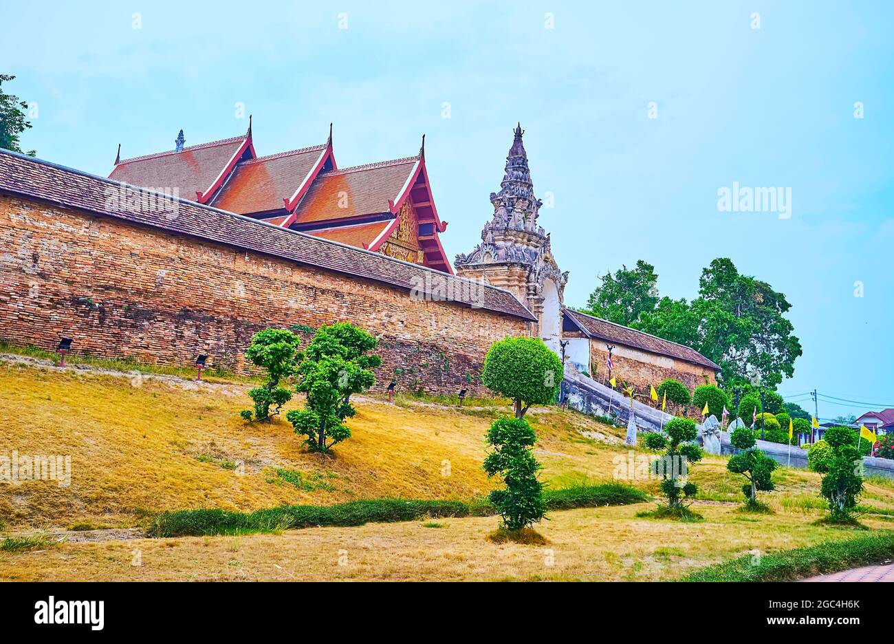 The brick rampart of ancient Wat Phra That Lampang Luang Temple with ...