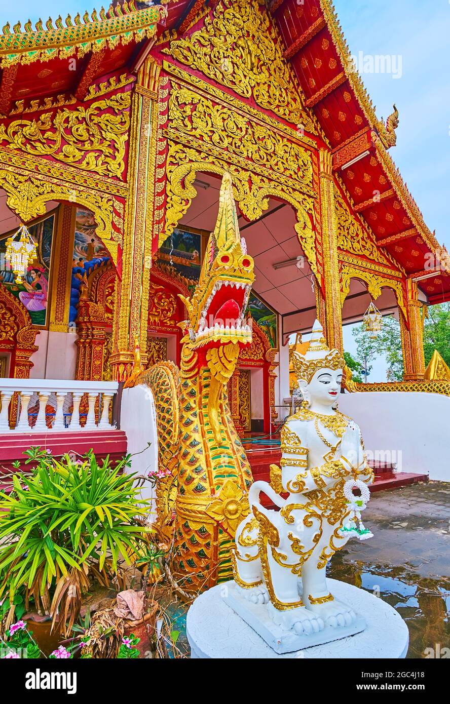 The Ubosot of the medieval Wat Sangkharam Temple with sculptures of ...