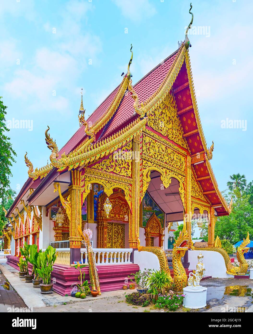 The splendid facade of Wat Sangkharam Temple with tall gable roof, fine ...