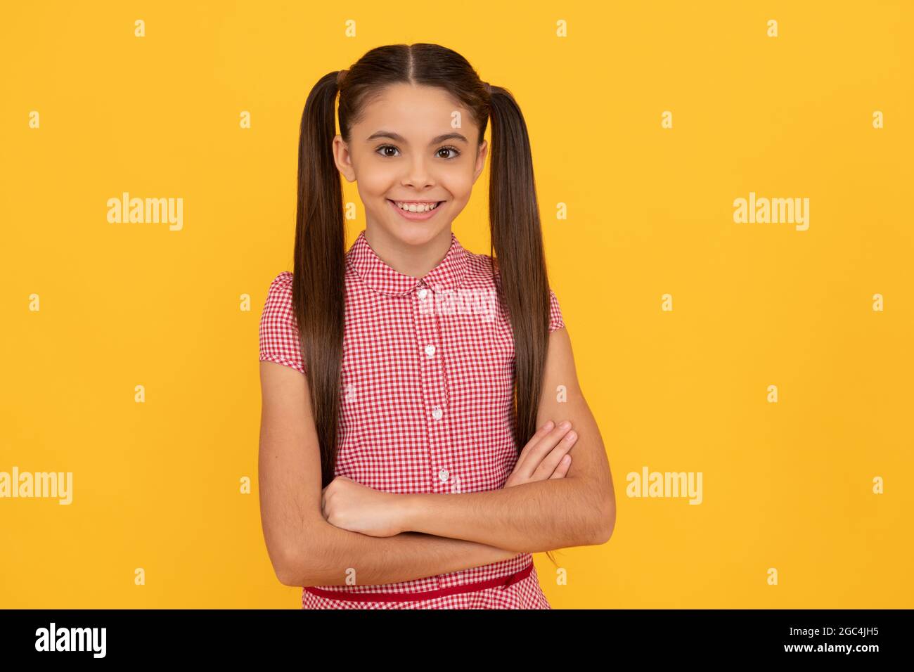 Happy confident child smile holding arms crossed yellow background ...