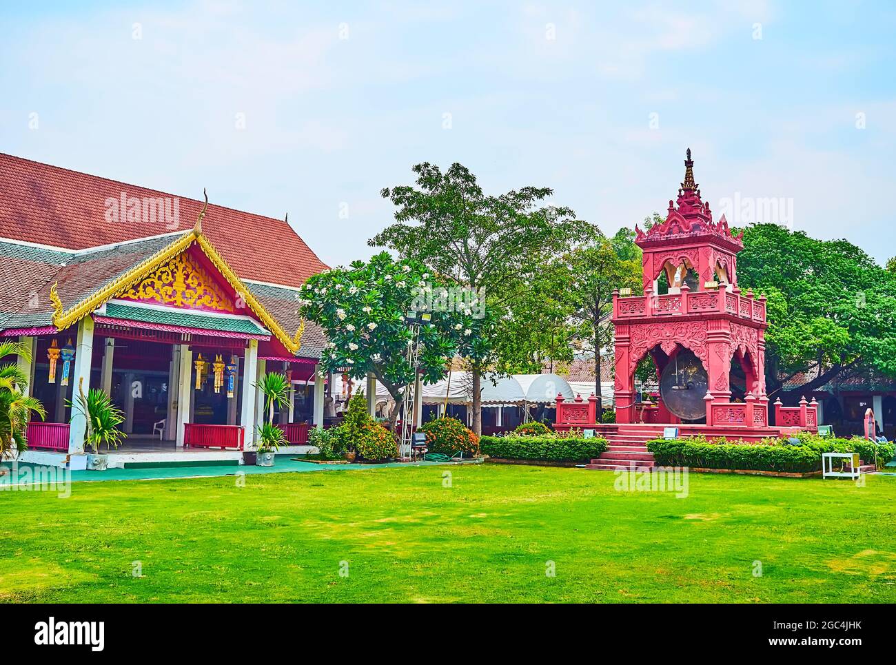 Walk the scenic green garden of Wat Phra That Hariphunchai Temple and ...
